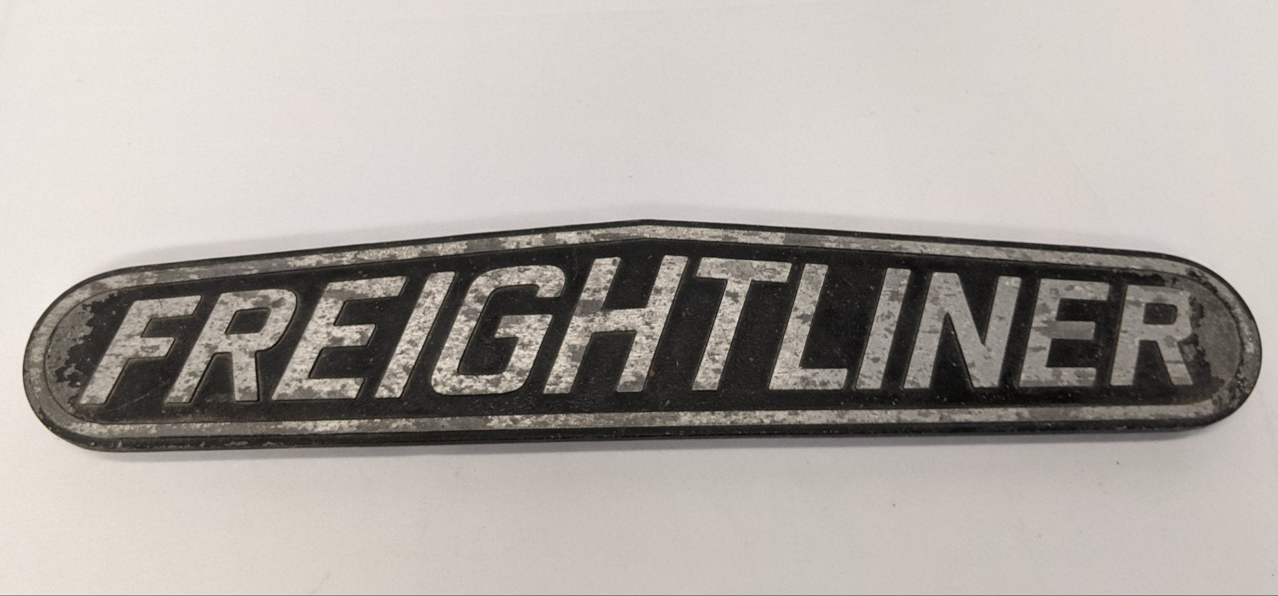 Freightliner Nameplate Emblem (22-39676-002) - Damaged
